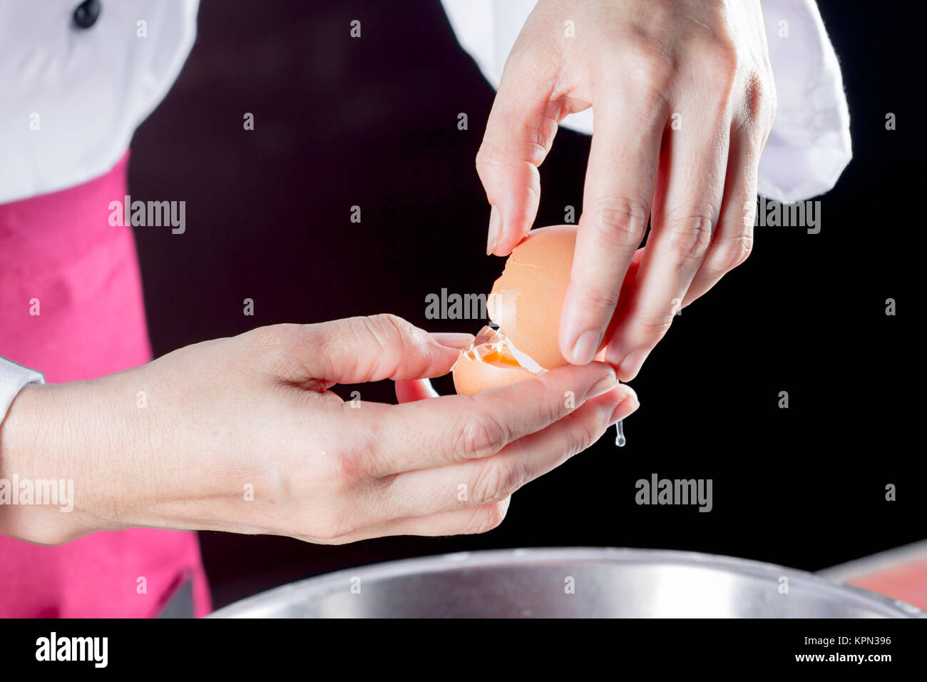 cracking an egg Stock Photo - Alamy