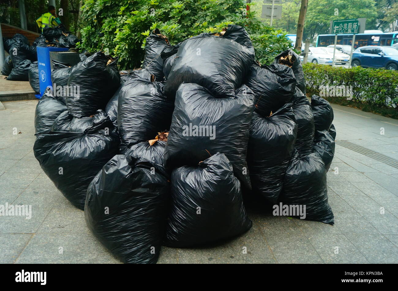 Black plastic bags filled with garbage, heaps of heaps, on the city ...
