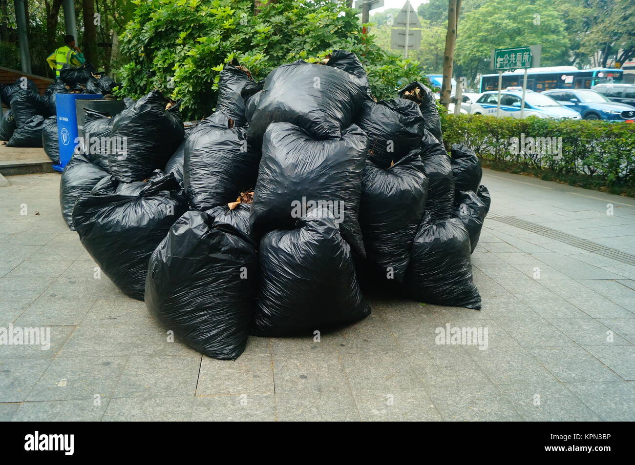 Black plastic bags filled with garbage, heaps of heaps, on the city ...