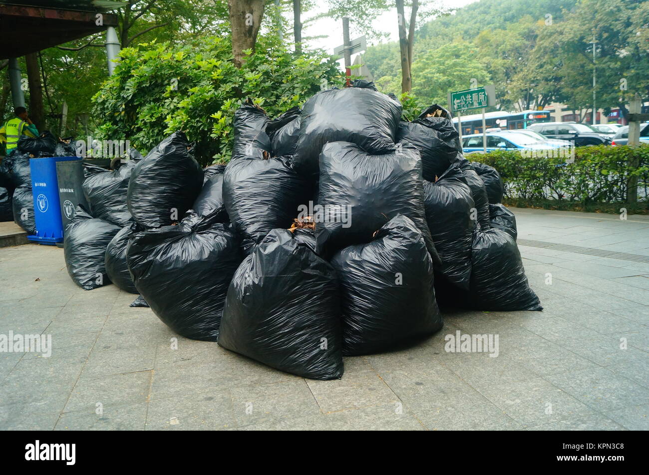 Black plastic bags filled with garbage, heaps of heaps, on the city ...