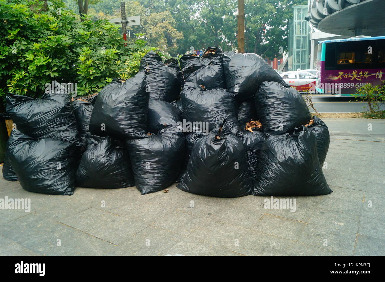 Black plastic bags filled with garbage, heaps of heaps, on the city ...