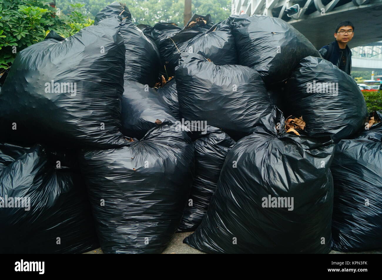 Black plastic bags filled with garbage, heaps of heaps, on the city ...