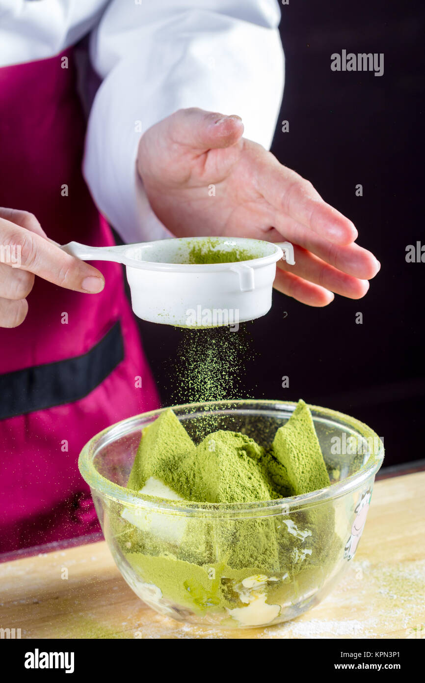 Sieving flour into mixing bowl hi-res stock photography and images - Alamy