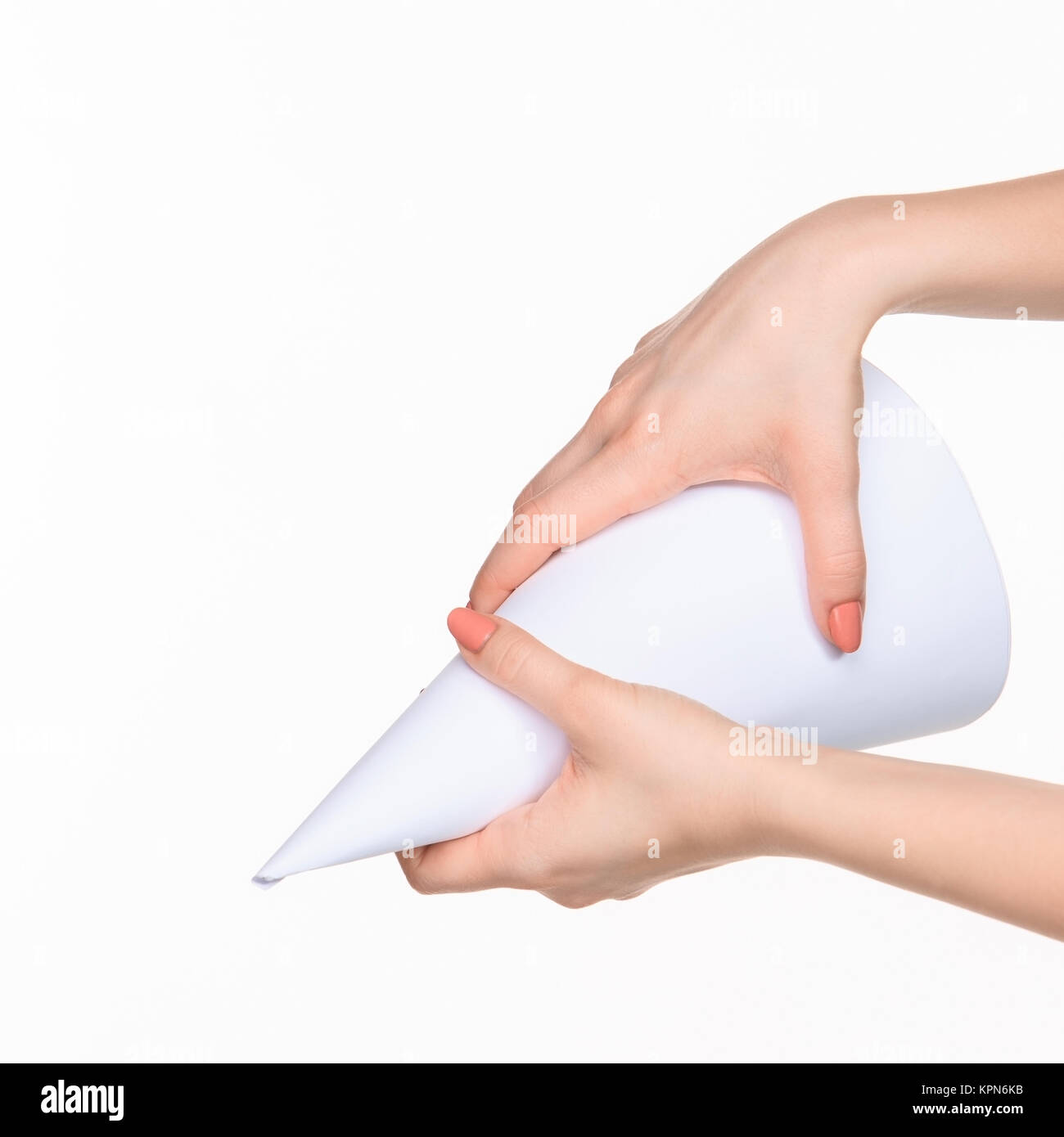 The cone in female hands on white background Stock Photo - Alamy