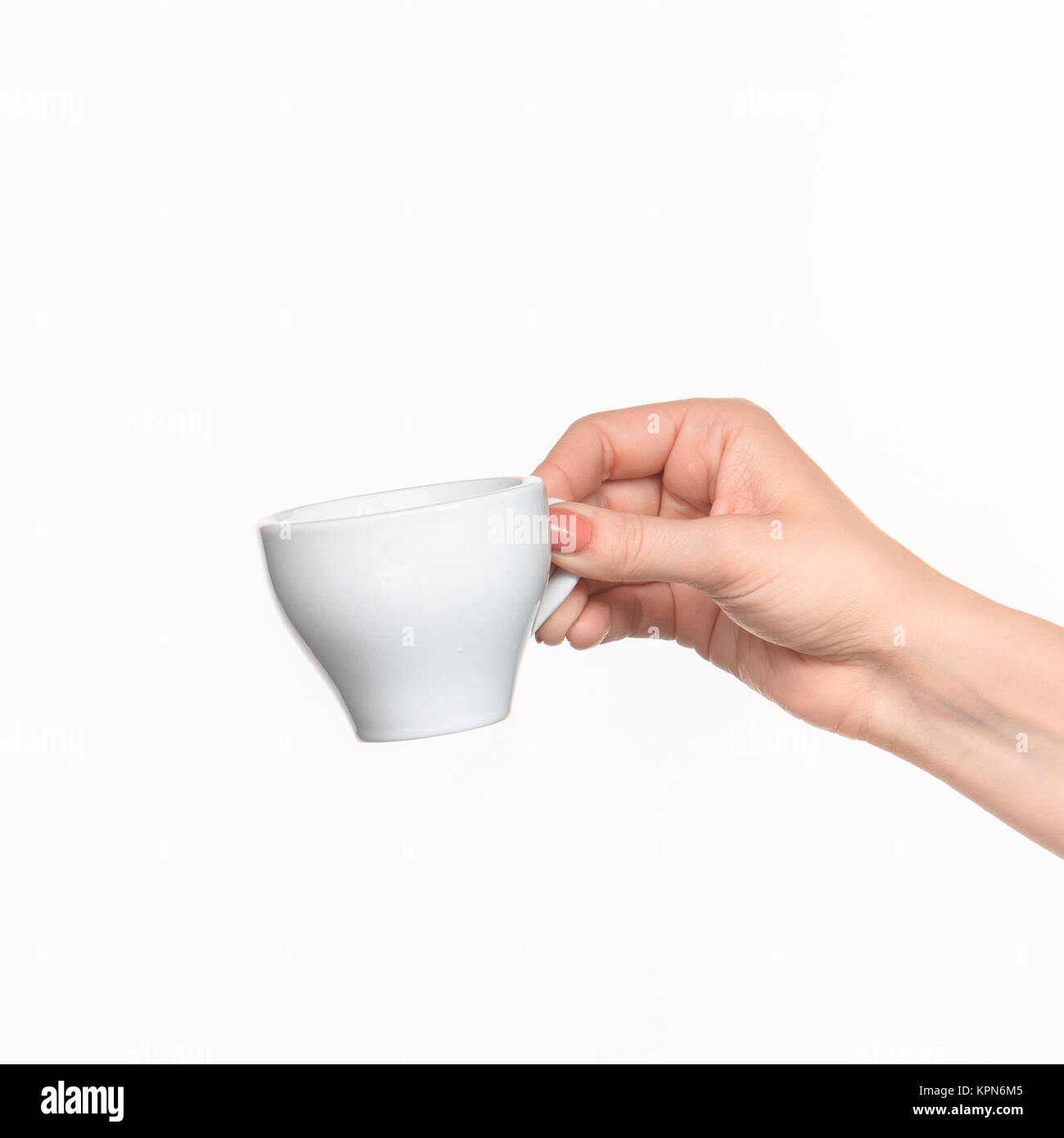 Woman hand with cup on white background Stock Photo - Alamy