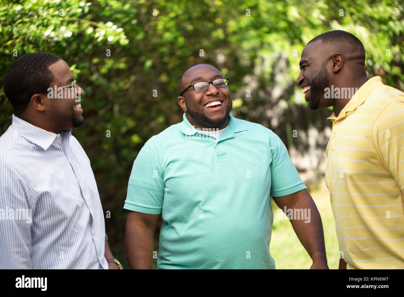Brothers laughing and talking Stock Photo - Alamy