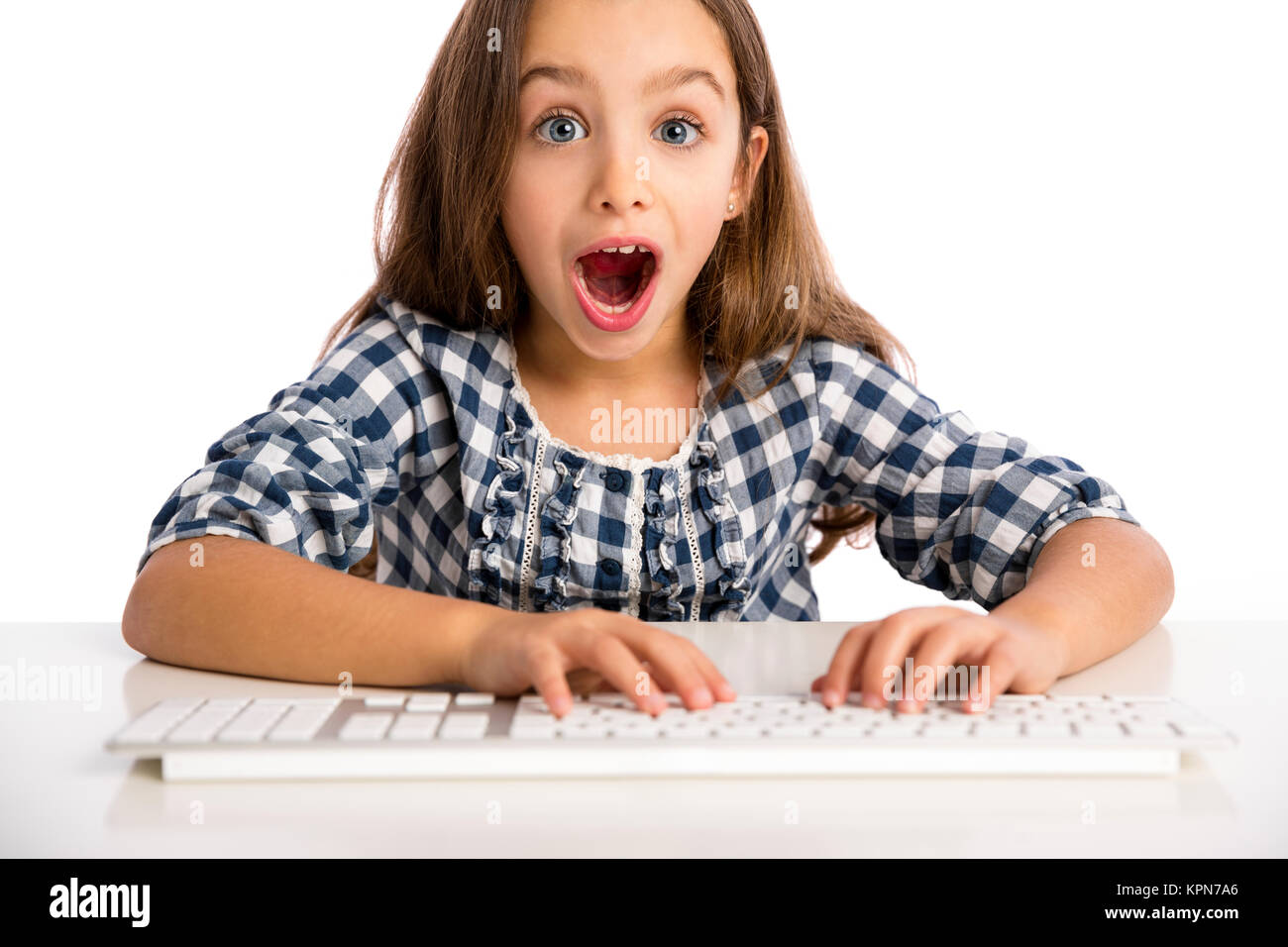 Little girl working with a computer Stock Photo - Alamy