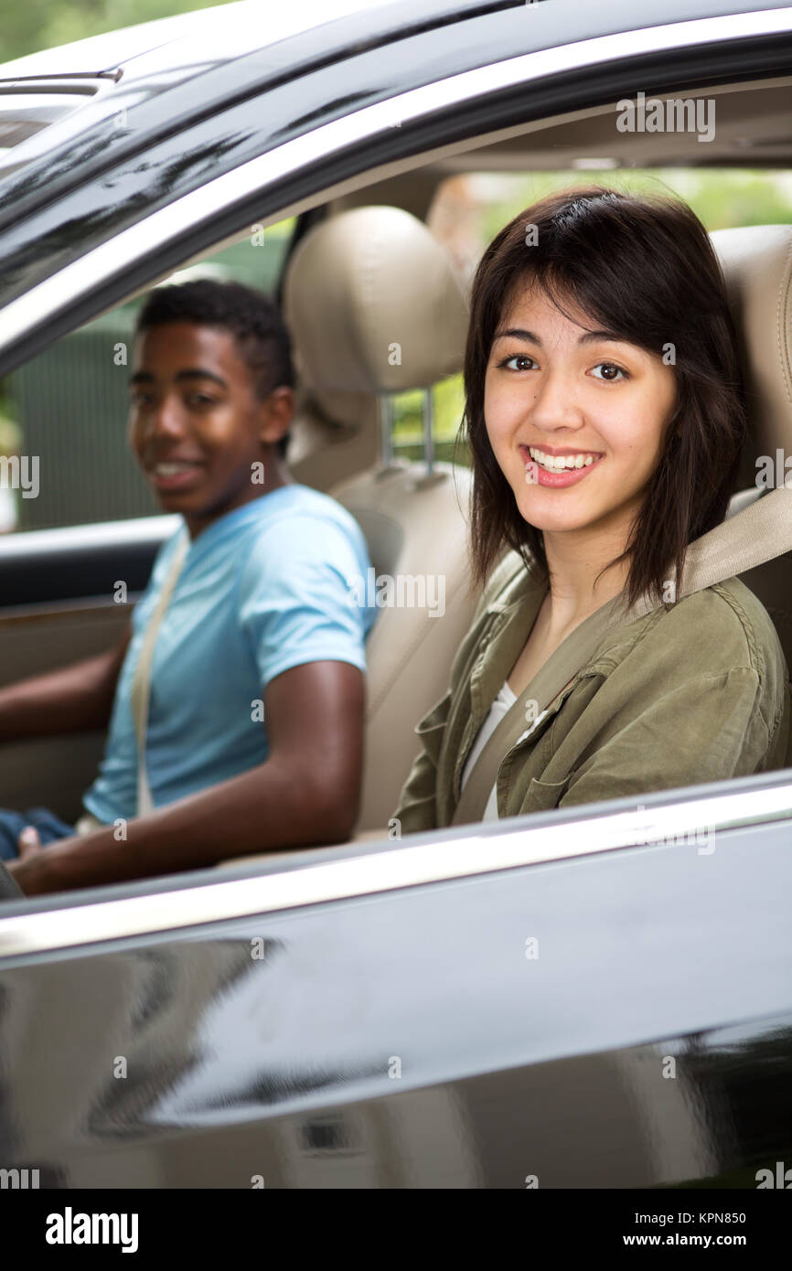 Two teenage friends driving Stock Photo - Alamy