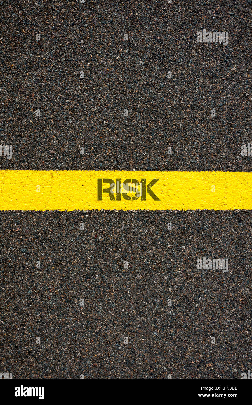 Road marking yellow line with word RISK Stock Photo - Alamy