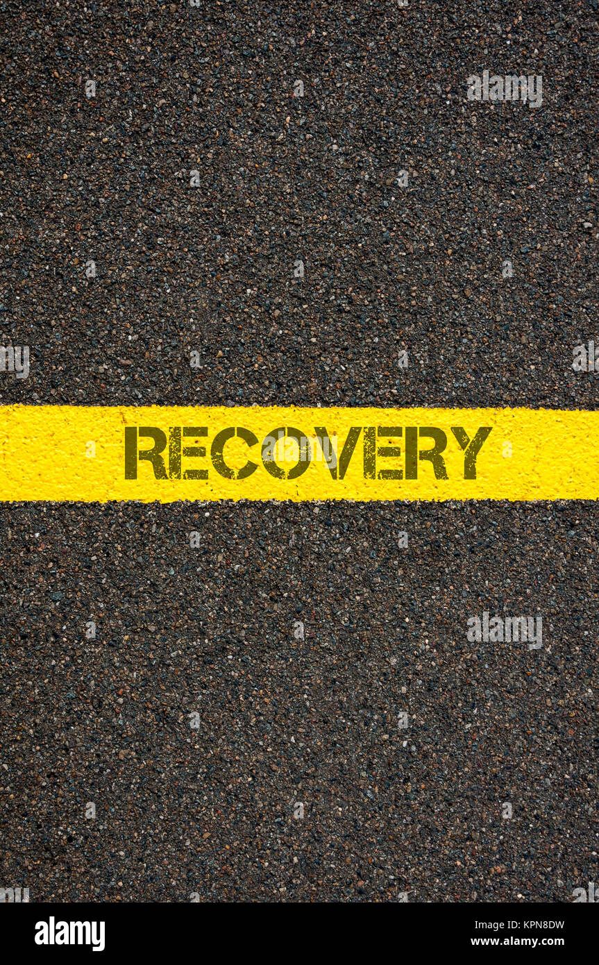 Road marking yellow line with word RECOVERY Stock Photo - Alamy