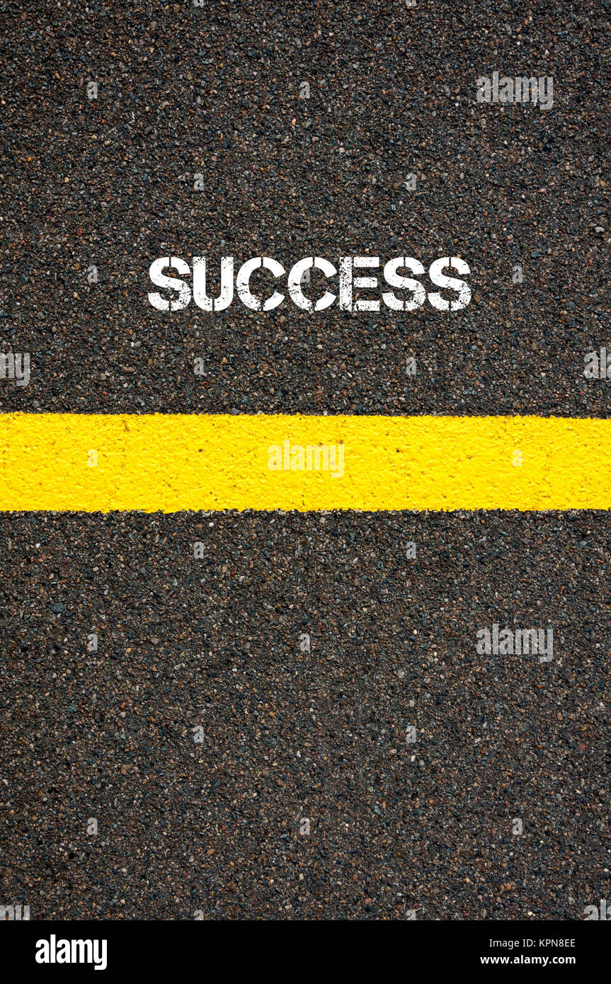 Road marking yellow line with word SUCCESS Stock Photo - Alamy