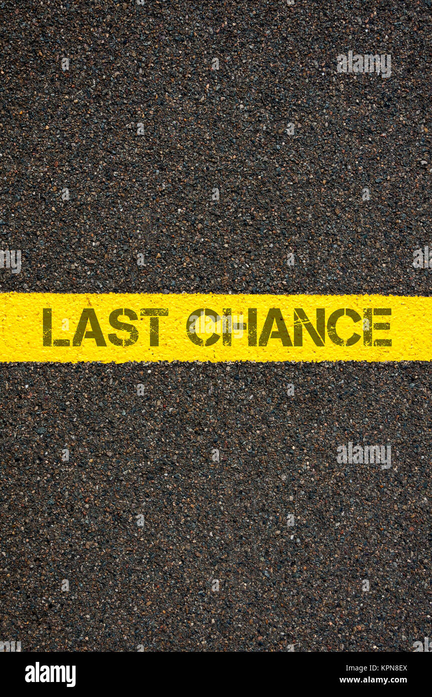 Road marking yellow line with words LAST CHANCE Stock Photo - Alamy