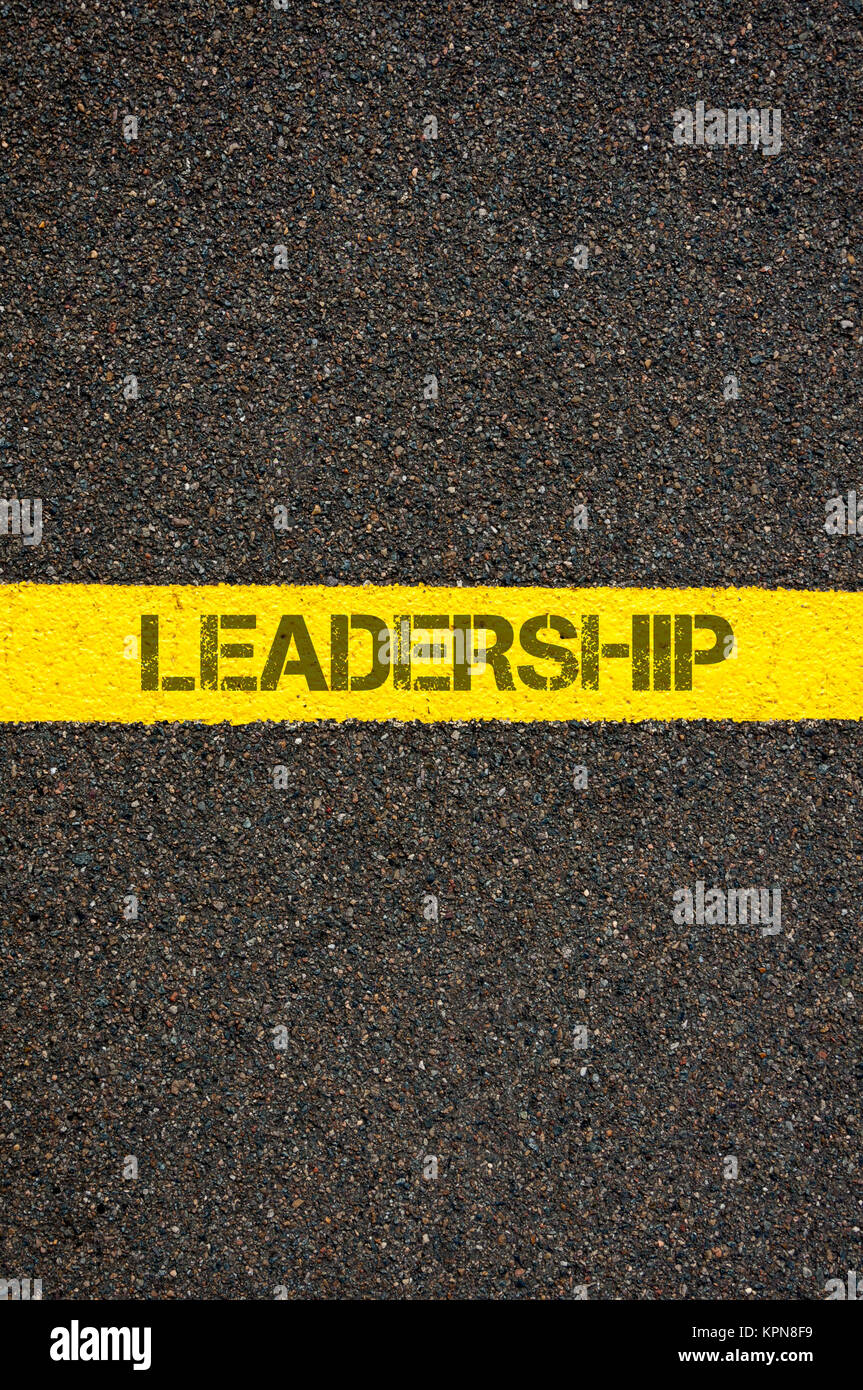 Road marking yellow line with word LEADERSHIP Stock Photo - Alamy