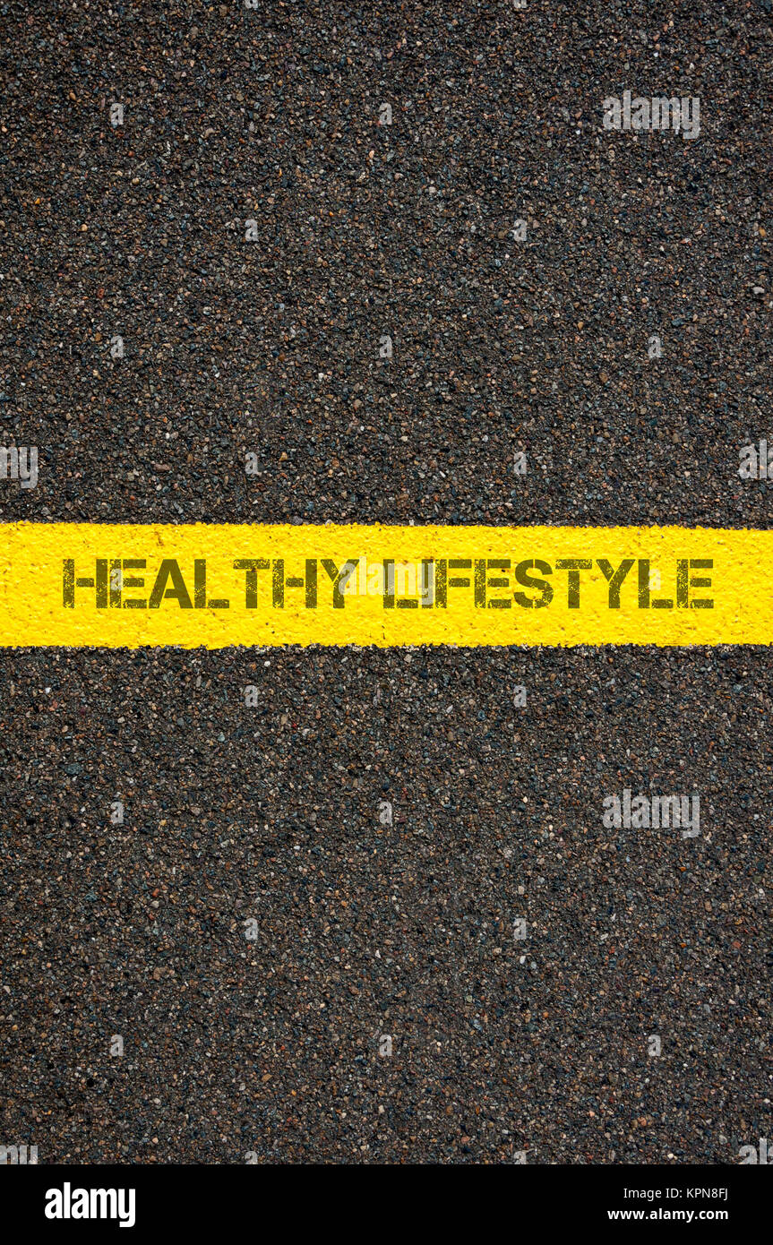 Road marking yellow line with words HEALTHY LIFESTYLE Stock Photo - Alamy