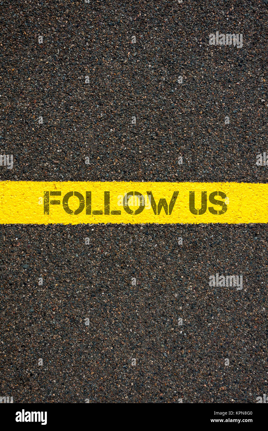 Road marking yellow line with words FOLLOW US Stock Photo - Alamy