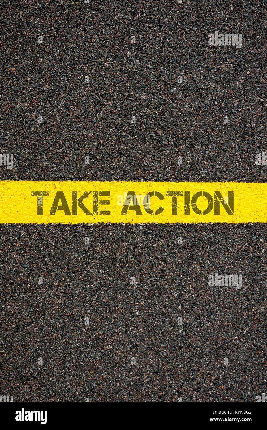 Road marking yellow line with words TAKE ACTION Stock Photo - Alamy