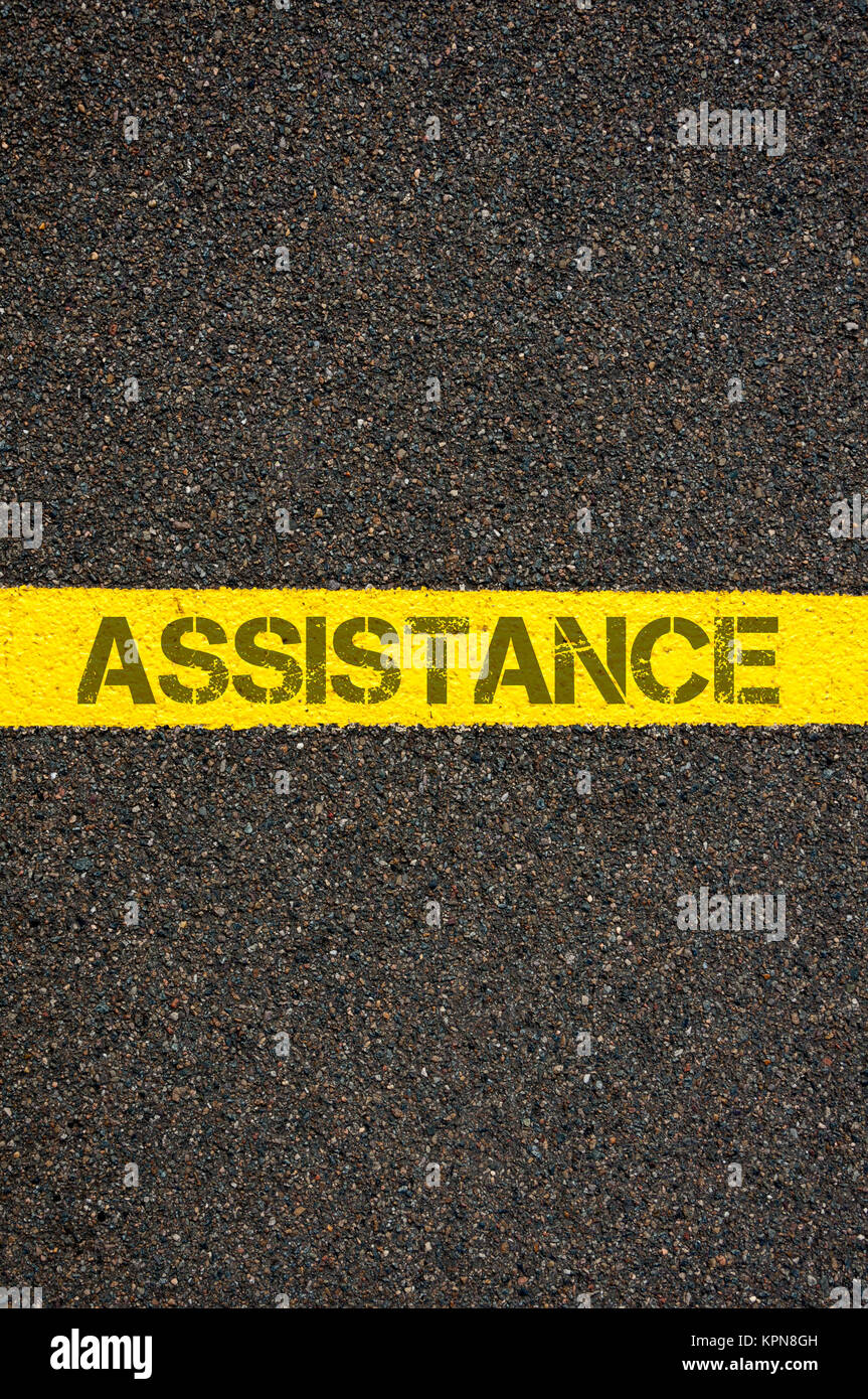 Road marking yellow line with word ASSISTANCE Stock Photo - Alamy