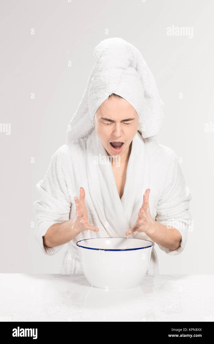 Young woman washing face with clean water Stock Photo - Alamy