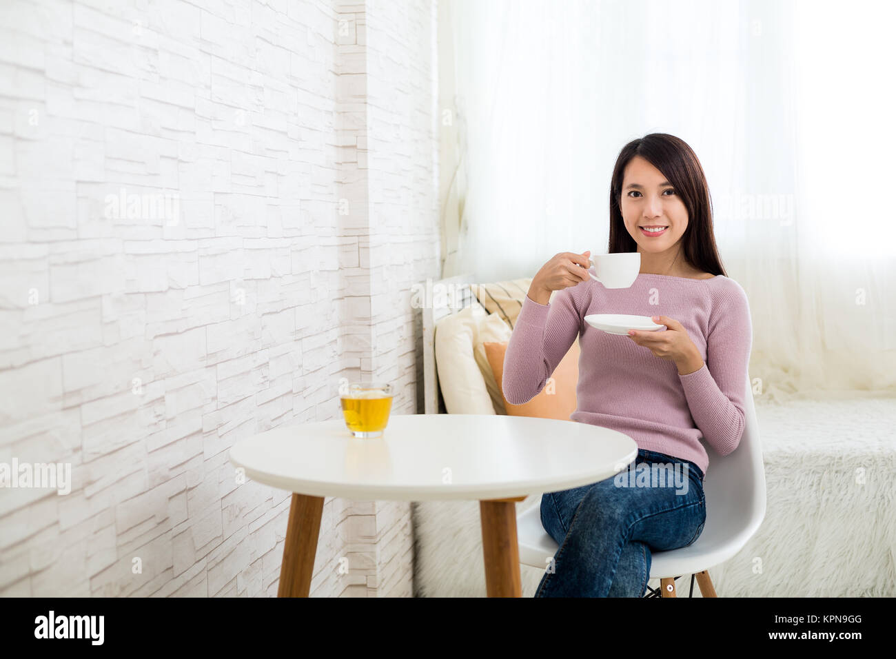 Woman enjoy tea at home Stock Photo - Alamy