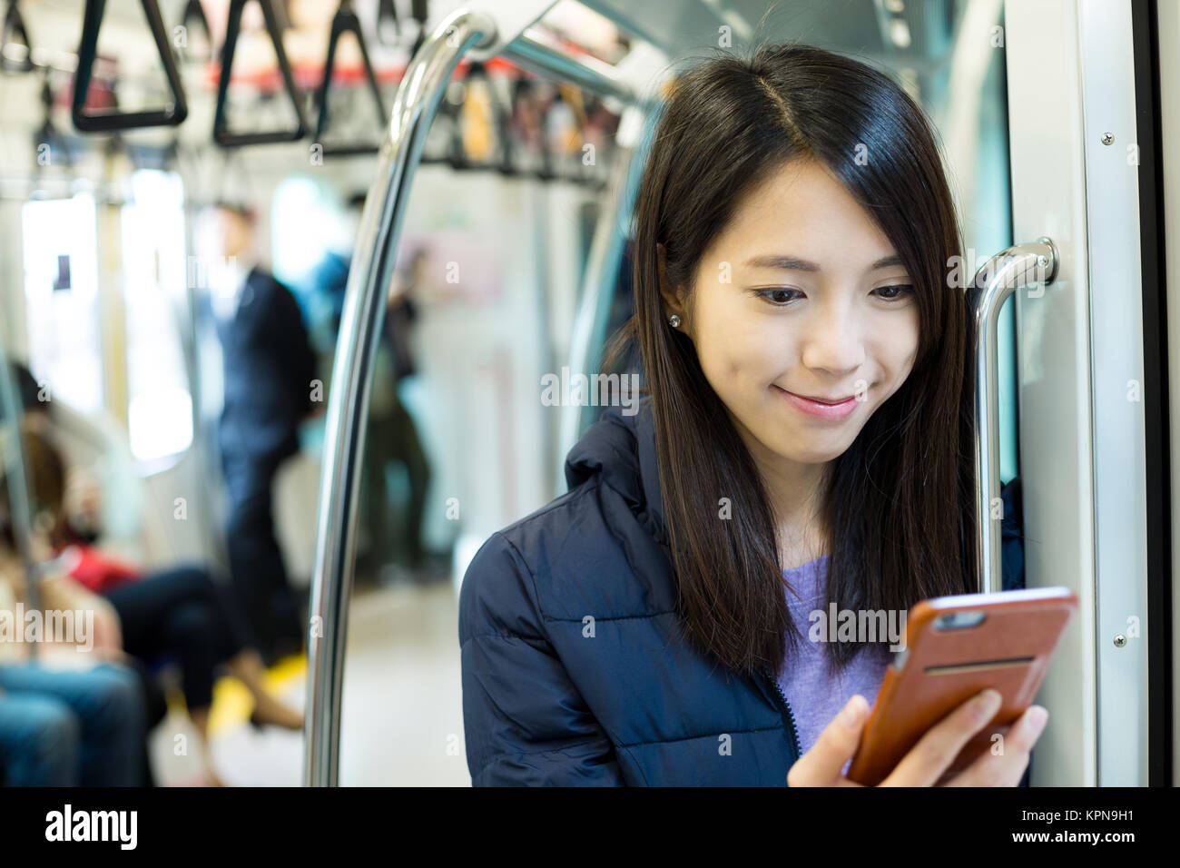 Woman use of cellphone inside train compartment Stock Photo - Alamy