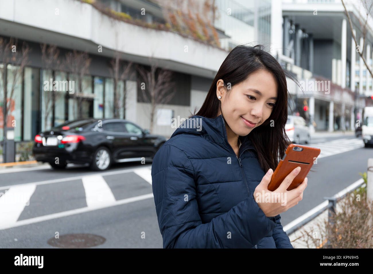 Woman use of mobile phone at outdoor Stock Photo - Alamy