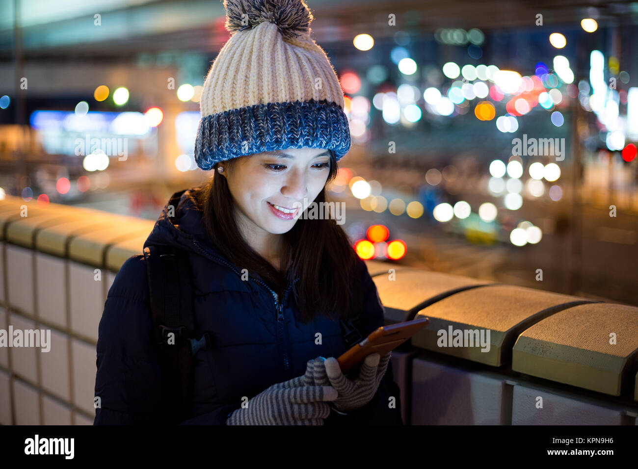 Woman use of mobile phone at outdoor Stock Photo - Alamy