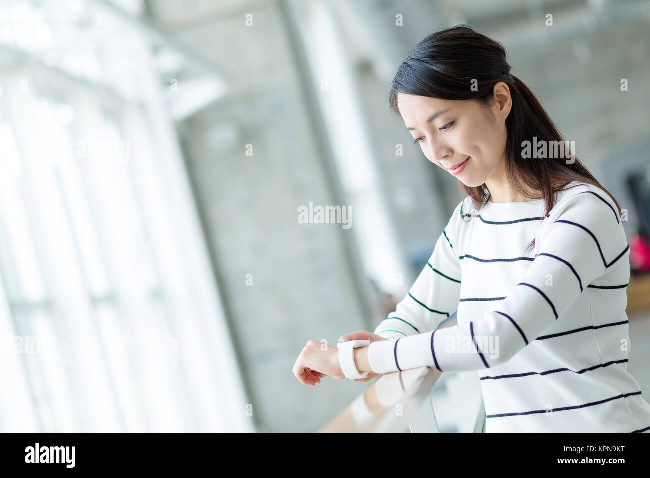 Woman touch on the smart watch Stock Photo - Alamy