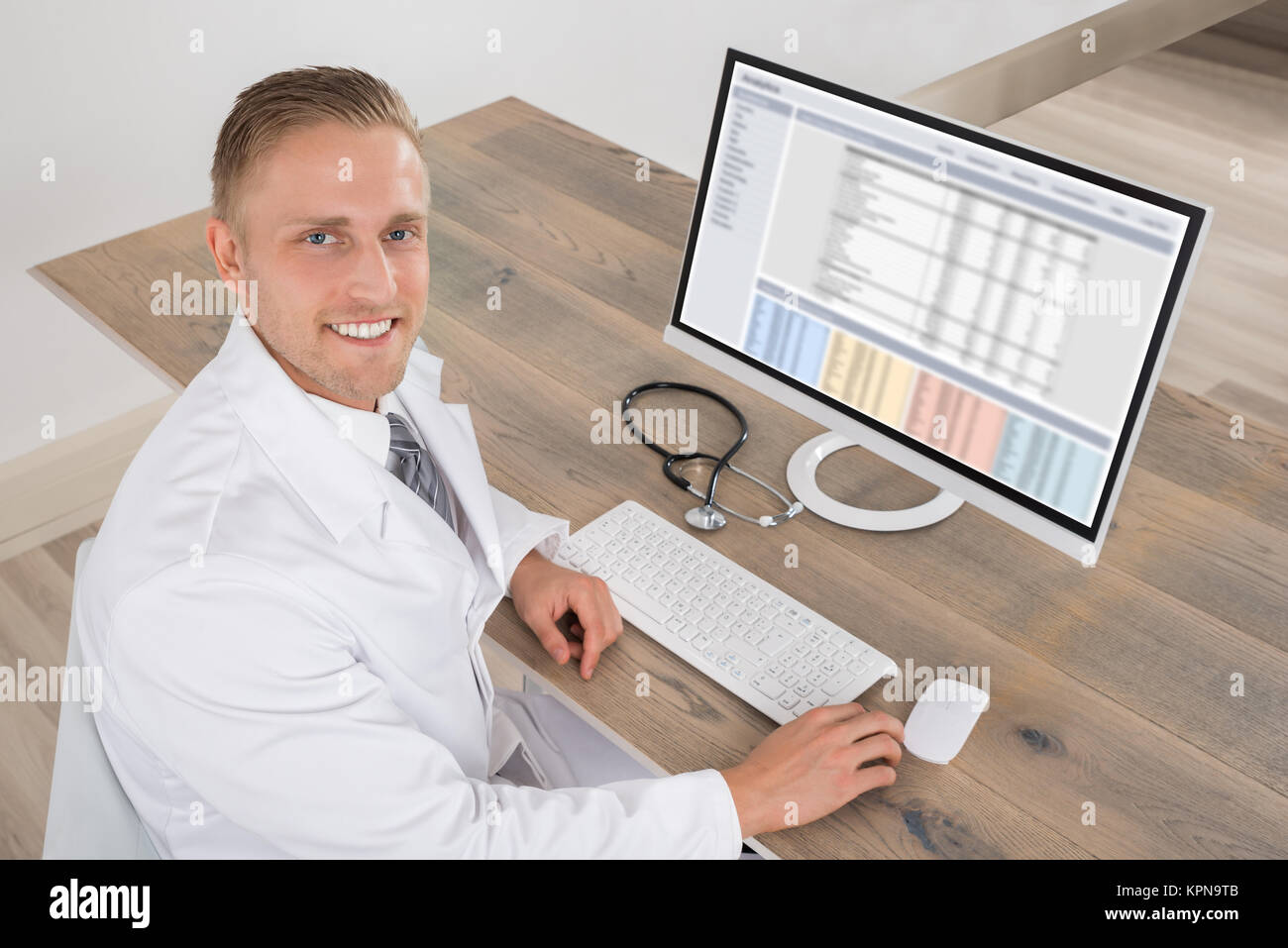Doctor Working On Computer Stock Photo - Alamy