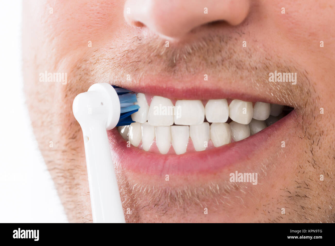 Man Teeth With Electric Toothbrush Stock Photo - Alamy