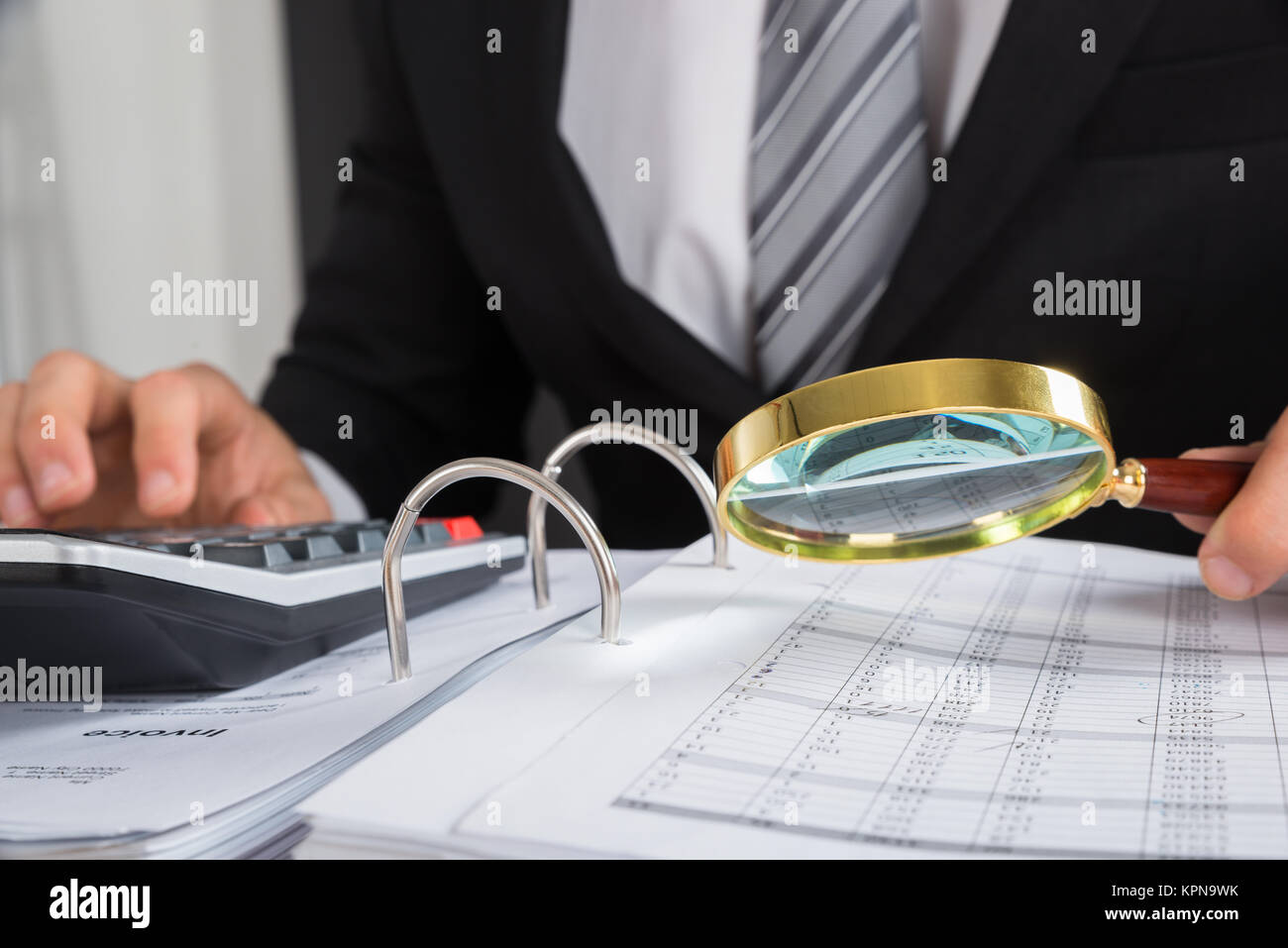 Young Businessman Checking Invoice Stock Photo - Alamy