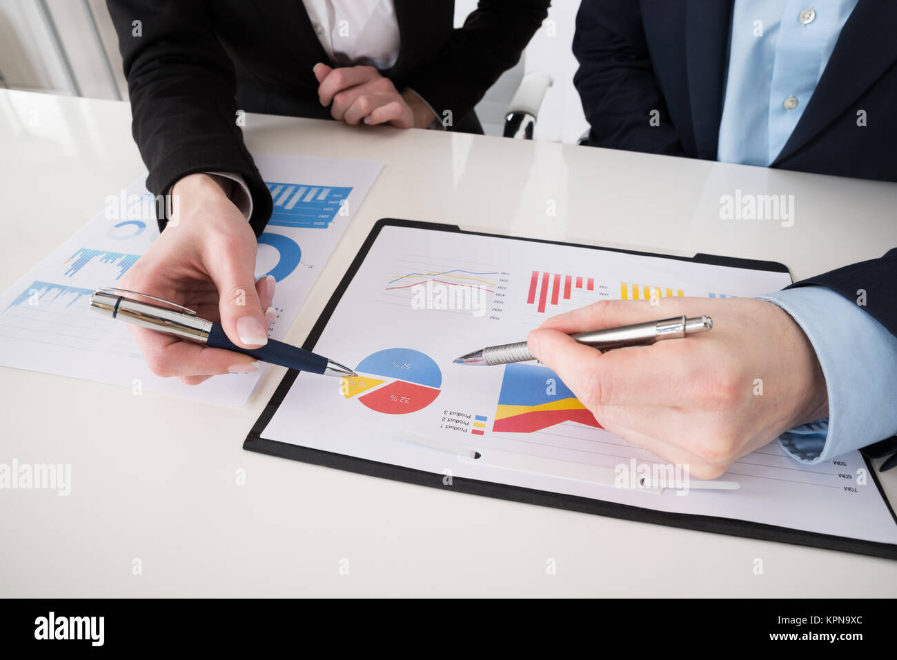 Businesspeople Working On Graph Stock Photo - Alamy