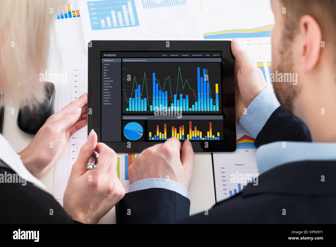 Two Businesspeople Analyzing Graph On Digital Tablet Stock Photo - Alamy Two Businesspeople Analyzing Graph On Digital Tablet Stock Photo - Alamy