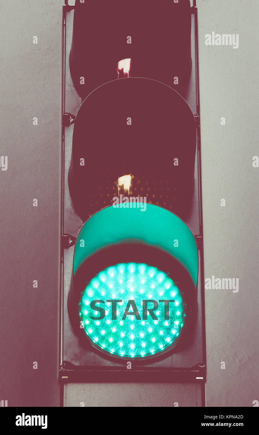 Close up on green traffic light with message START Stock Photo - Alamy