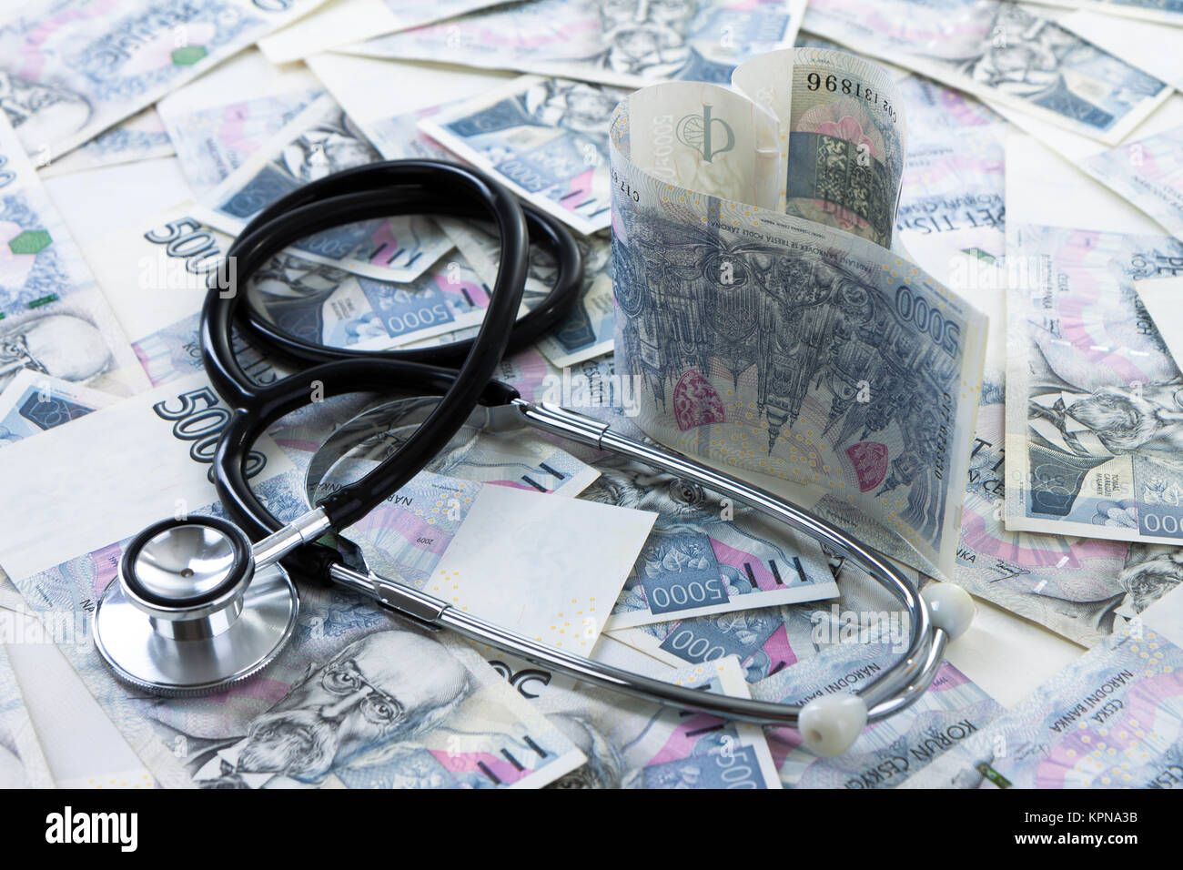 Czech paper money with stethoscope on white background Stock Photo - Alamy