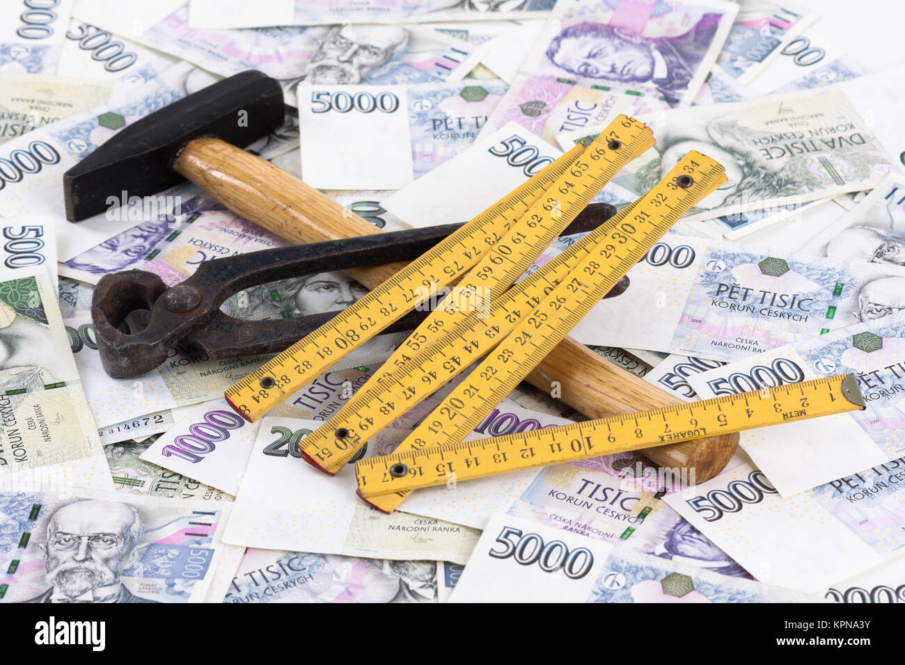 Czech paper money with craft tools on white background Stock Photo - Alamy