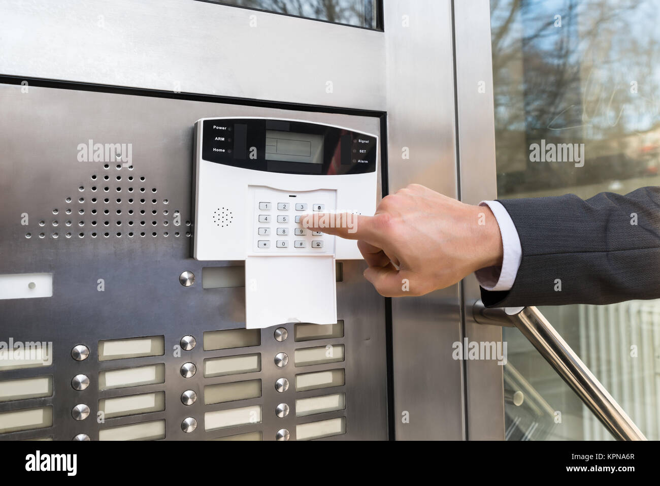 Close-up Of Businessperson Entering Code In Security System Stock Photo ...