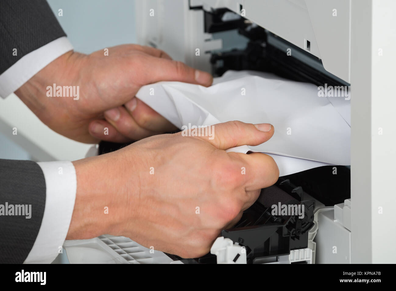 Businessman Removing Paper Stuck In Printer At Office Stock Photo Alamy businessman-removing-paper-stuck-in-printer-at-office-stock-photo-alamy