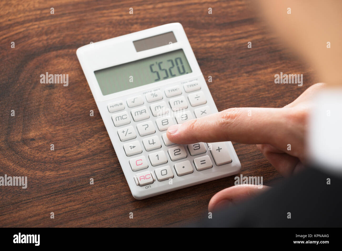 Businessman Hand Working On Calculator Stock Photo - Alamy