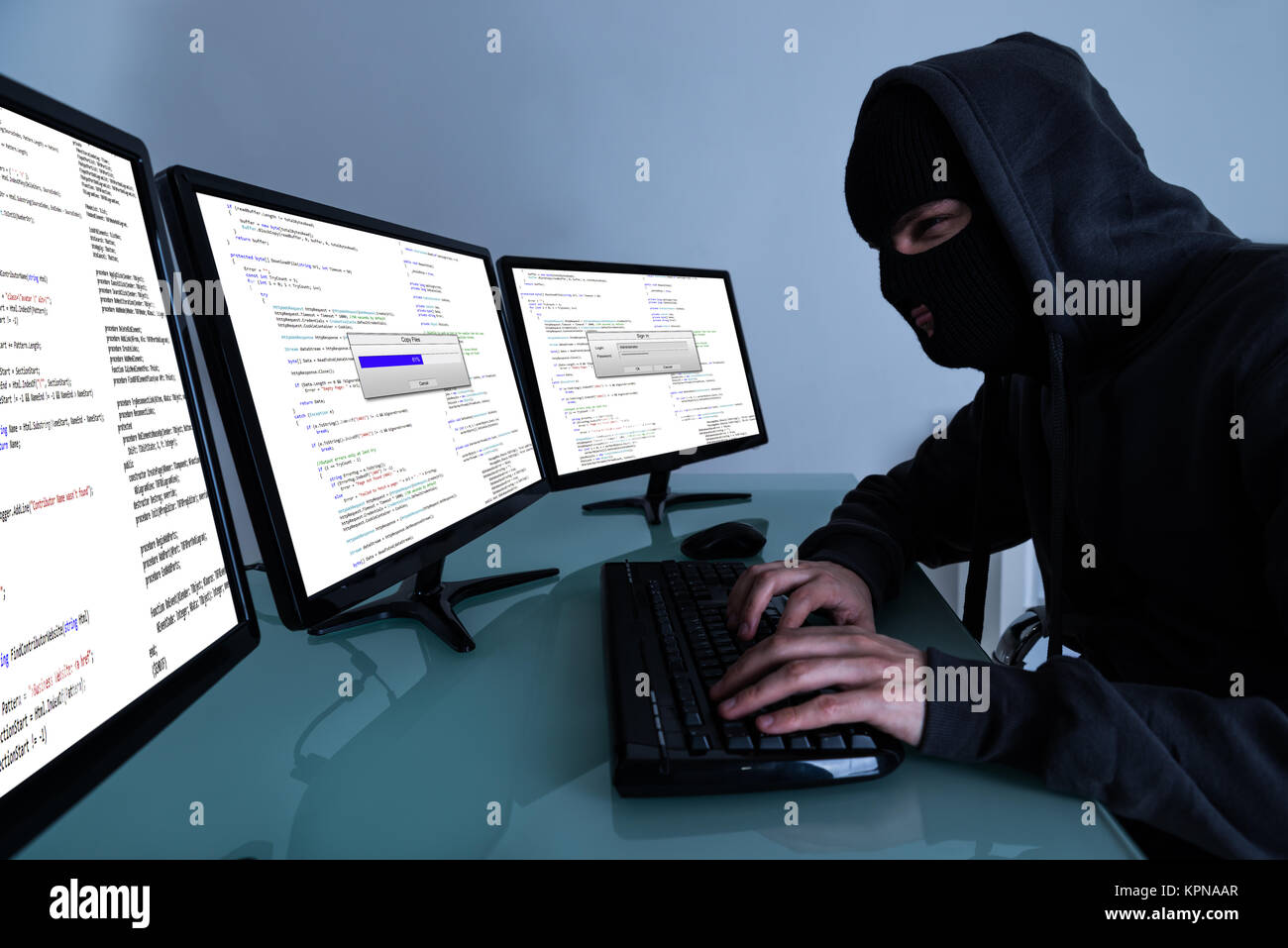 Hacker Stealing Data On Multiple Computers Stock Photo - Alamy
