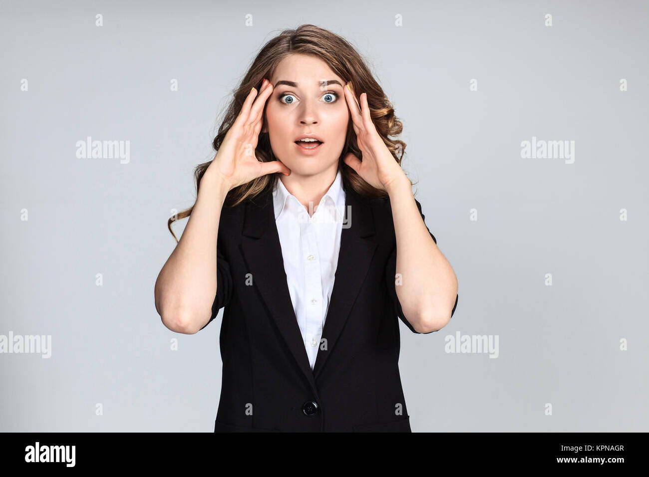 Portrait of young woman with shocked facial expression Stock Photo - Alamy