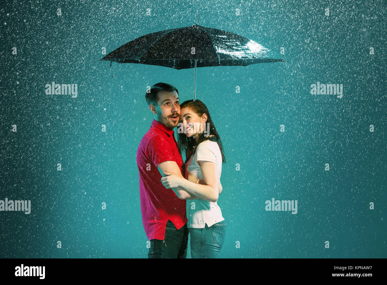 The loving couple in the rain Stock Photo - Alamy