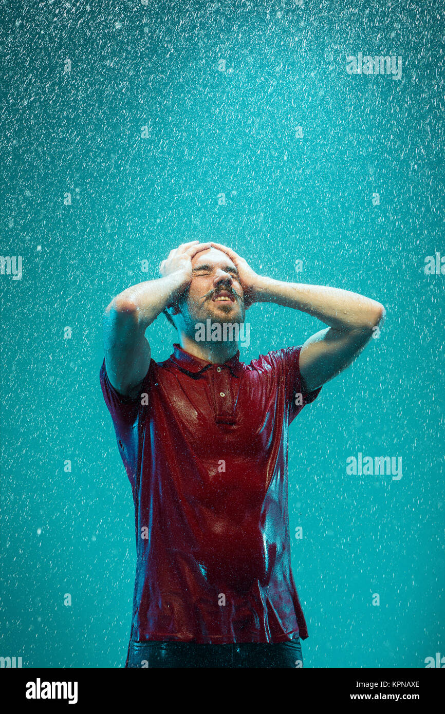 The portrait of young man in the rain Stock Photo - Alamy