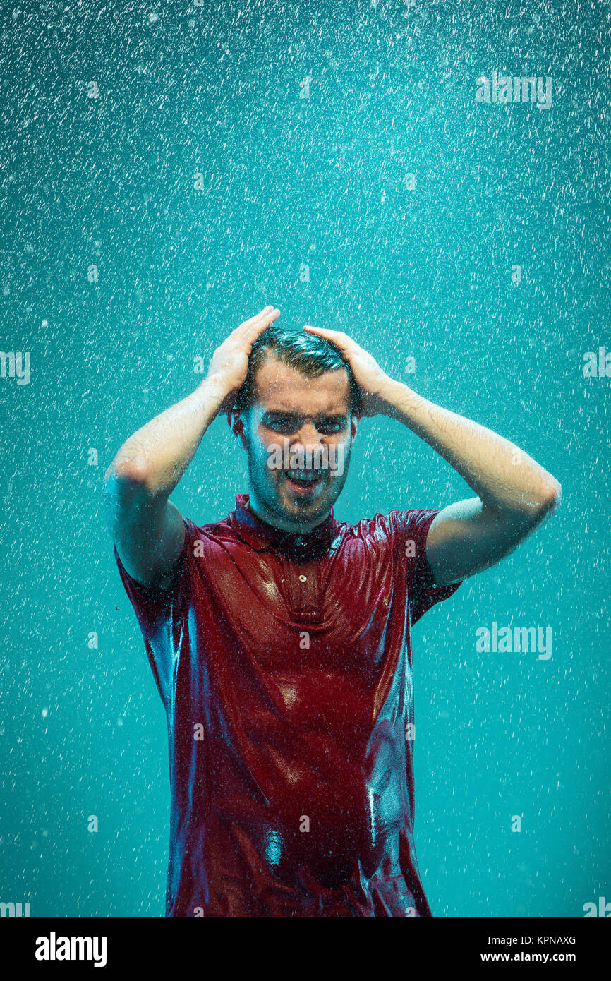 The portrait of young man in the rain Stock Photo - Alamy