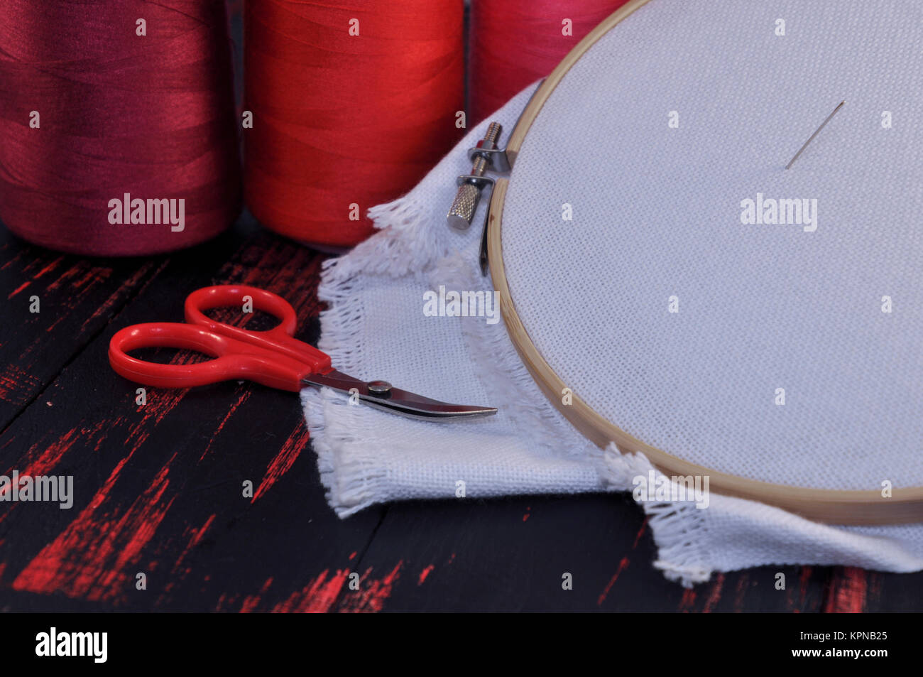 Fabric for embroidery with red threads Stock Photo - Alamy