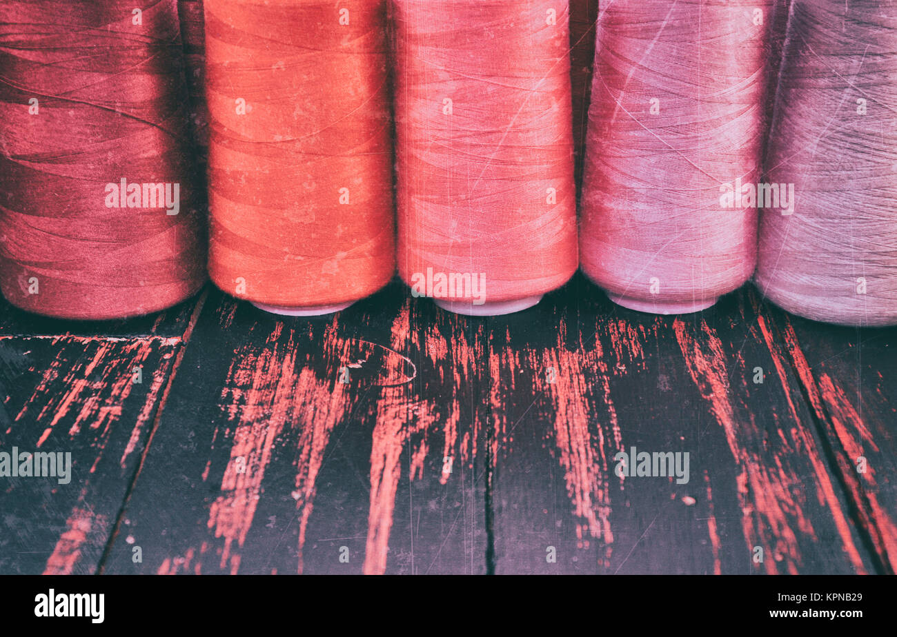 Retro photo thread spools in red scale sewing and needlework Stock ...