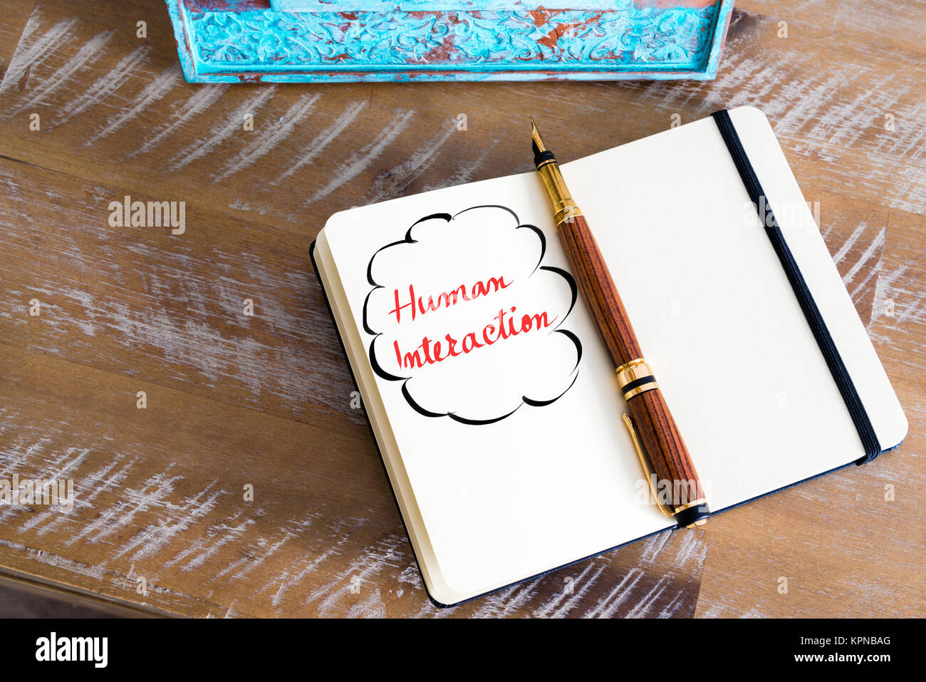 Written text Human Interaction in a cloud Stock Photo - Alamy
