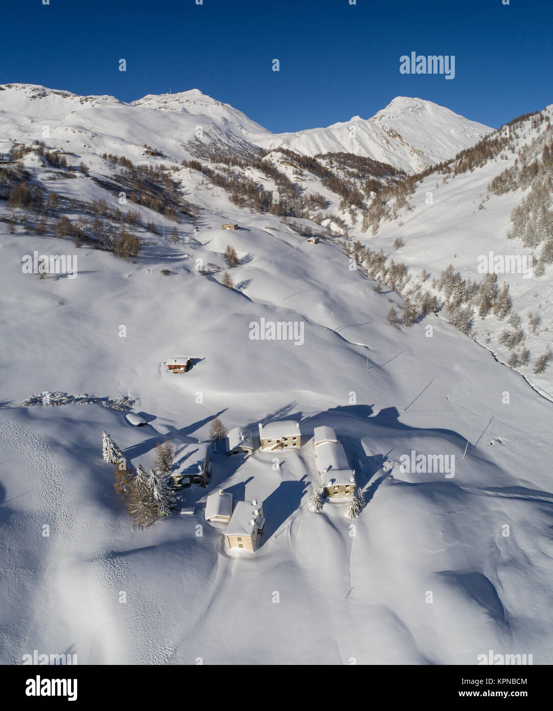 Little village covered with snow in mountain, Swiss Alps Stock Photo ...