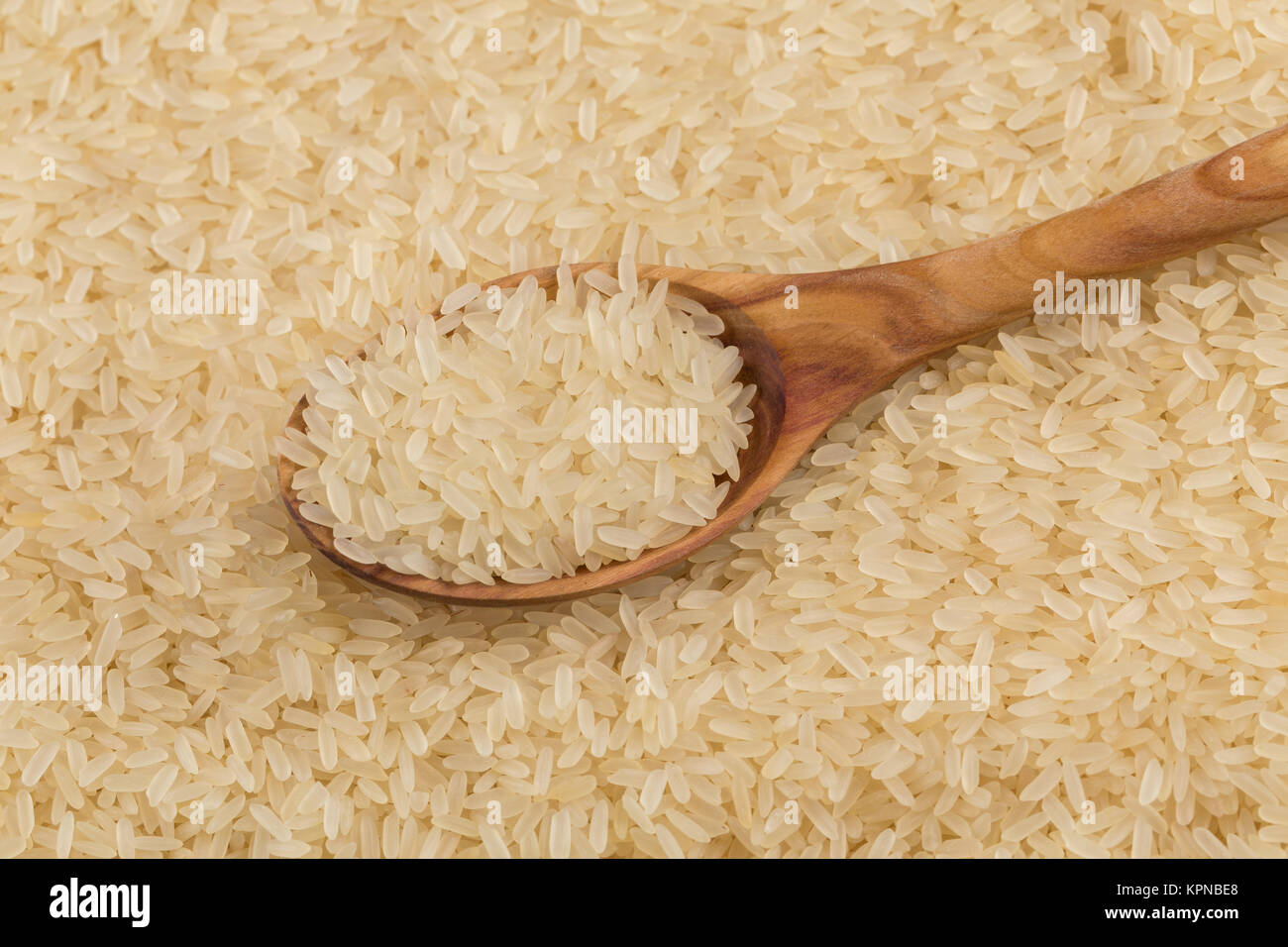 Rice in spoon Stock Photo - Alamy