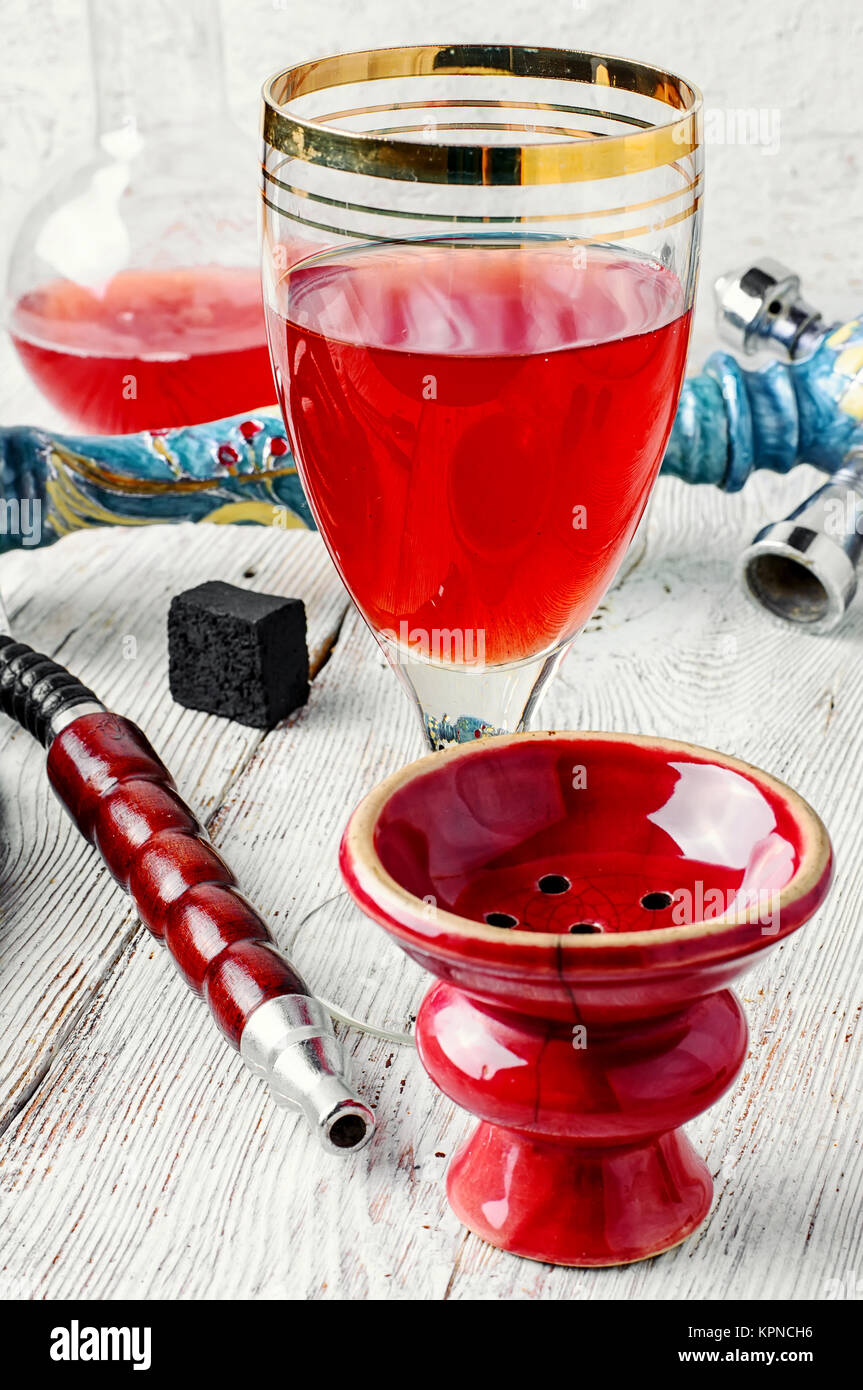 Details smoking Arab hookah and a glass of young wine pink Stock Photo ...
