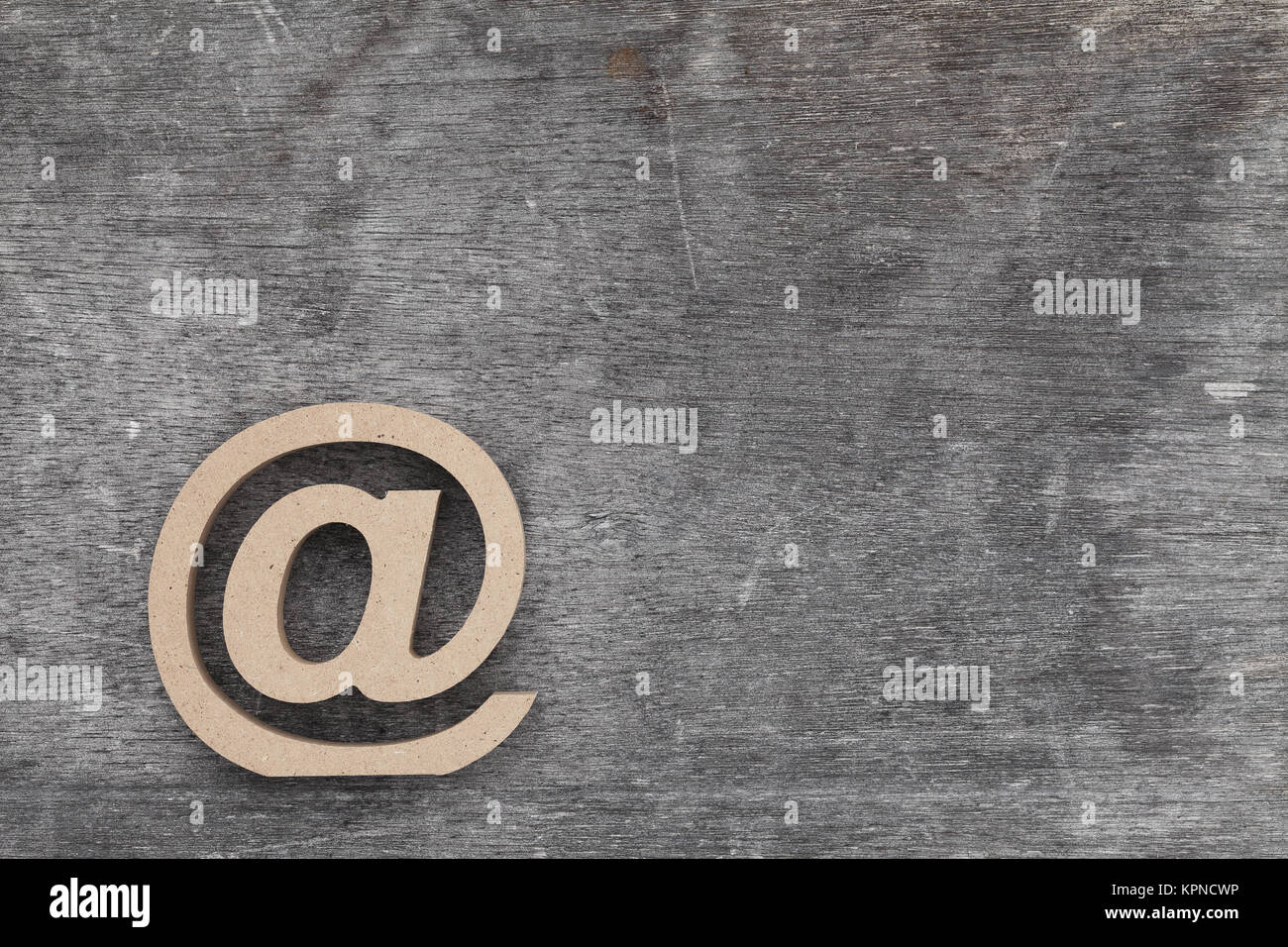 e-mail symbol on grunge wood background Stock Photo - Alamy